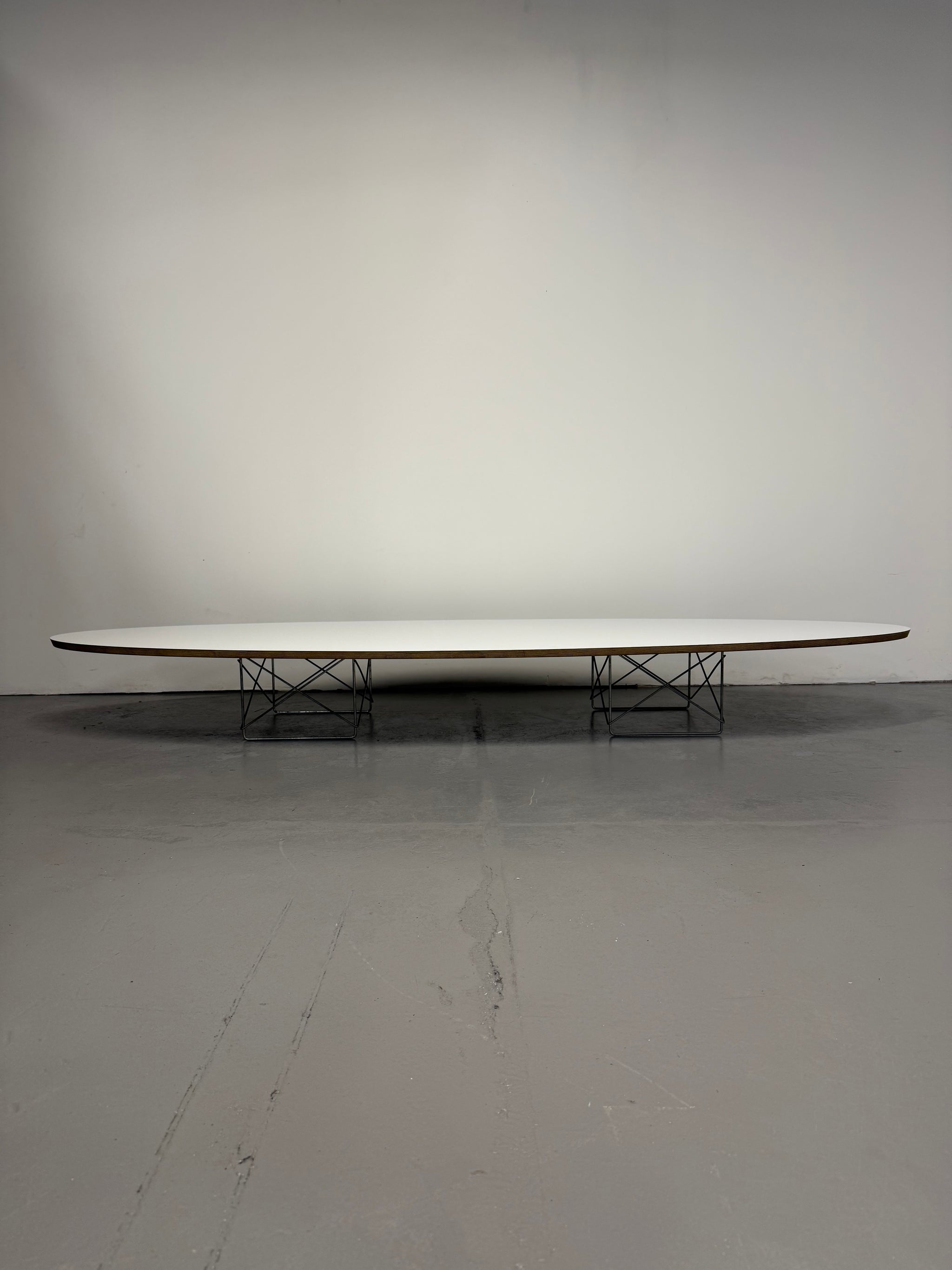 Eames “Surfboard” Table – Wire Base Elliptical by Herman Miller